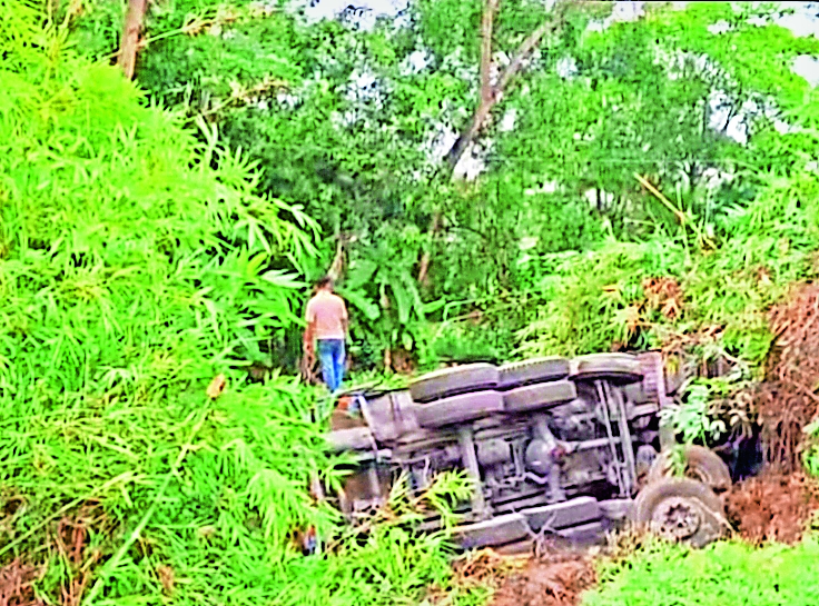 Scrap-laden truck overturned in a water-filled pit