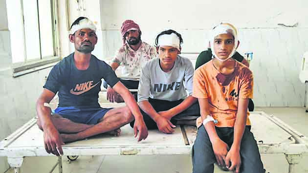 A minor altercation led to a bloody clash, injuring 12 people from two ...