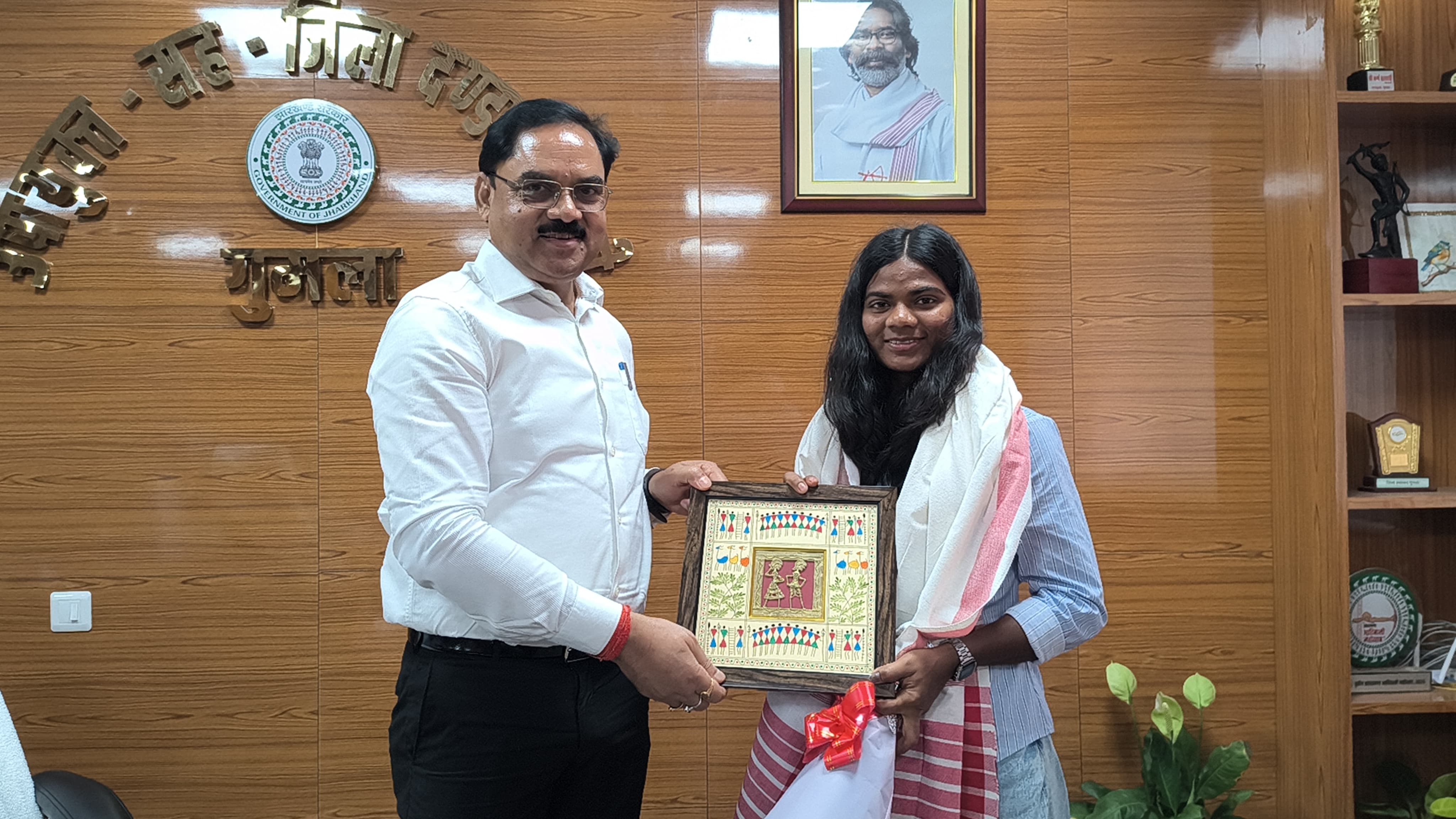 Football player Ashtam Oraon was honored by the district administration.