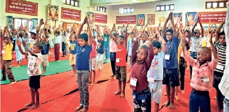 Children are learning meditation, yoga and pranayama in the Sanskar camp.