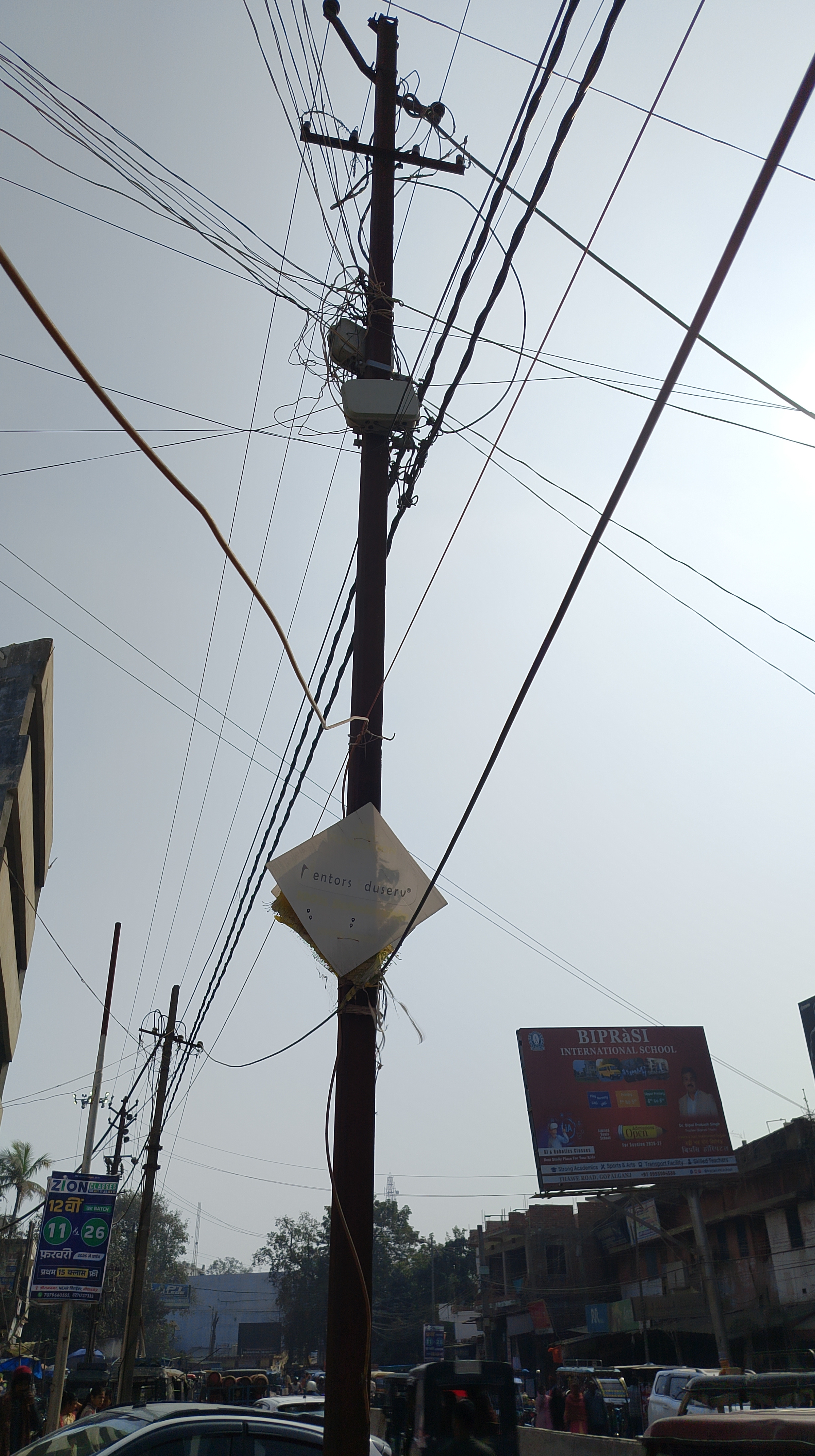 A tangle of wires on electric poles in the city
