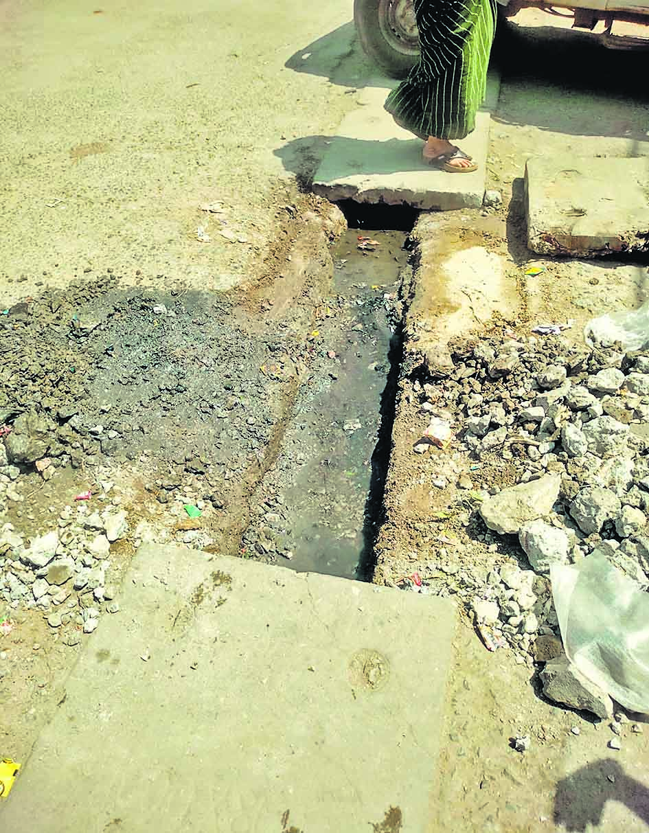 Open drain outside the vegetable market is a cause of trouble