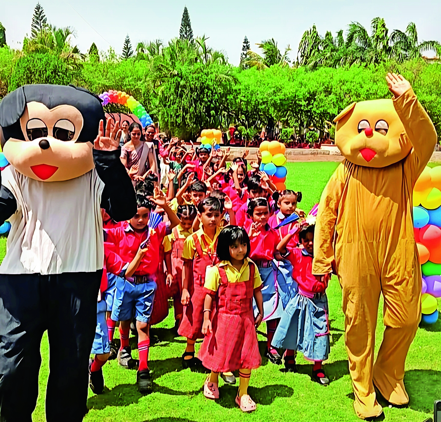 Children enter school with cartoon friends Mickey Mouse and Teddy Bear ...