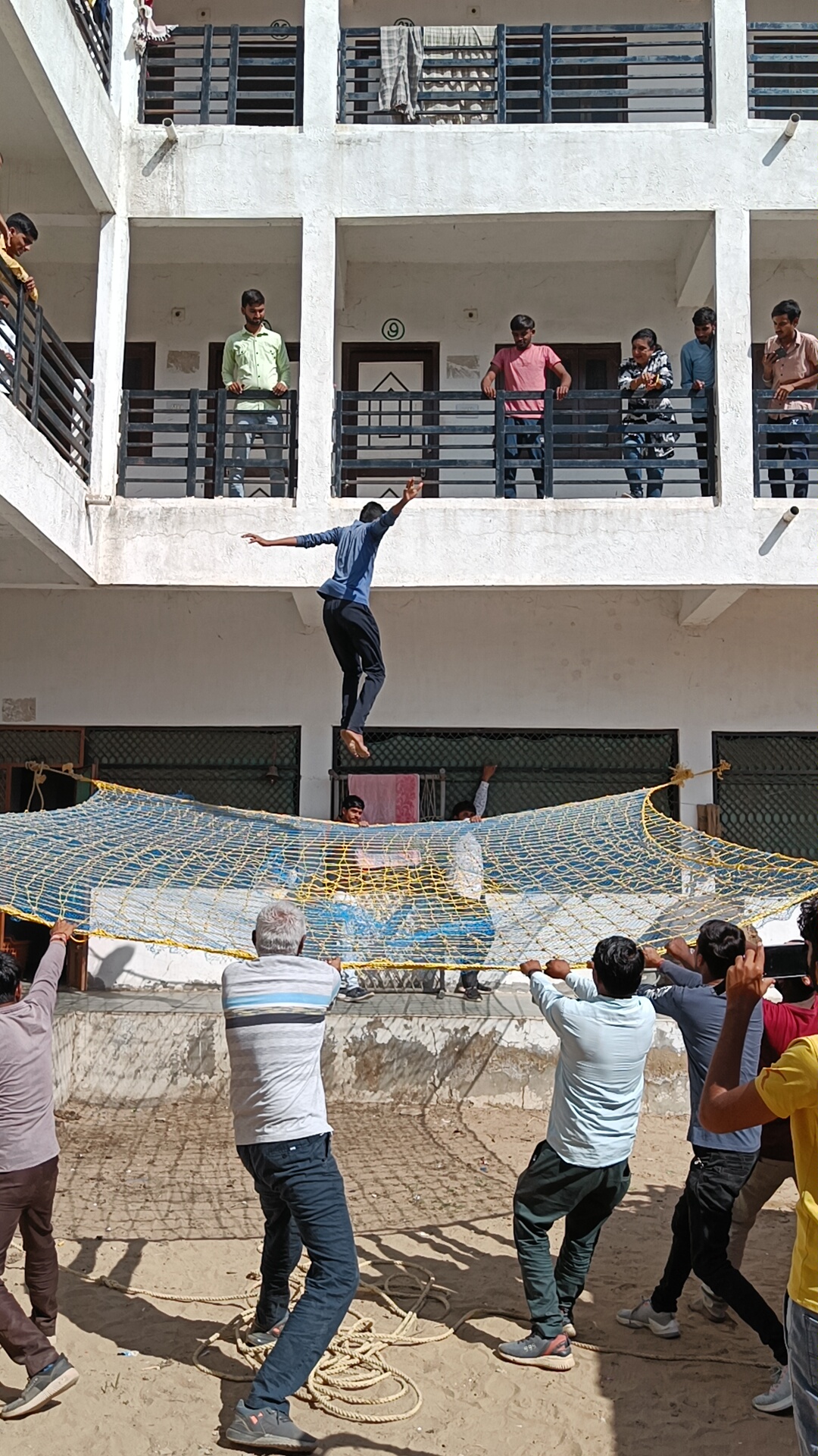 People trapped in a multi-storey building were trained on how to jump ...