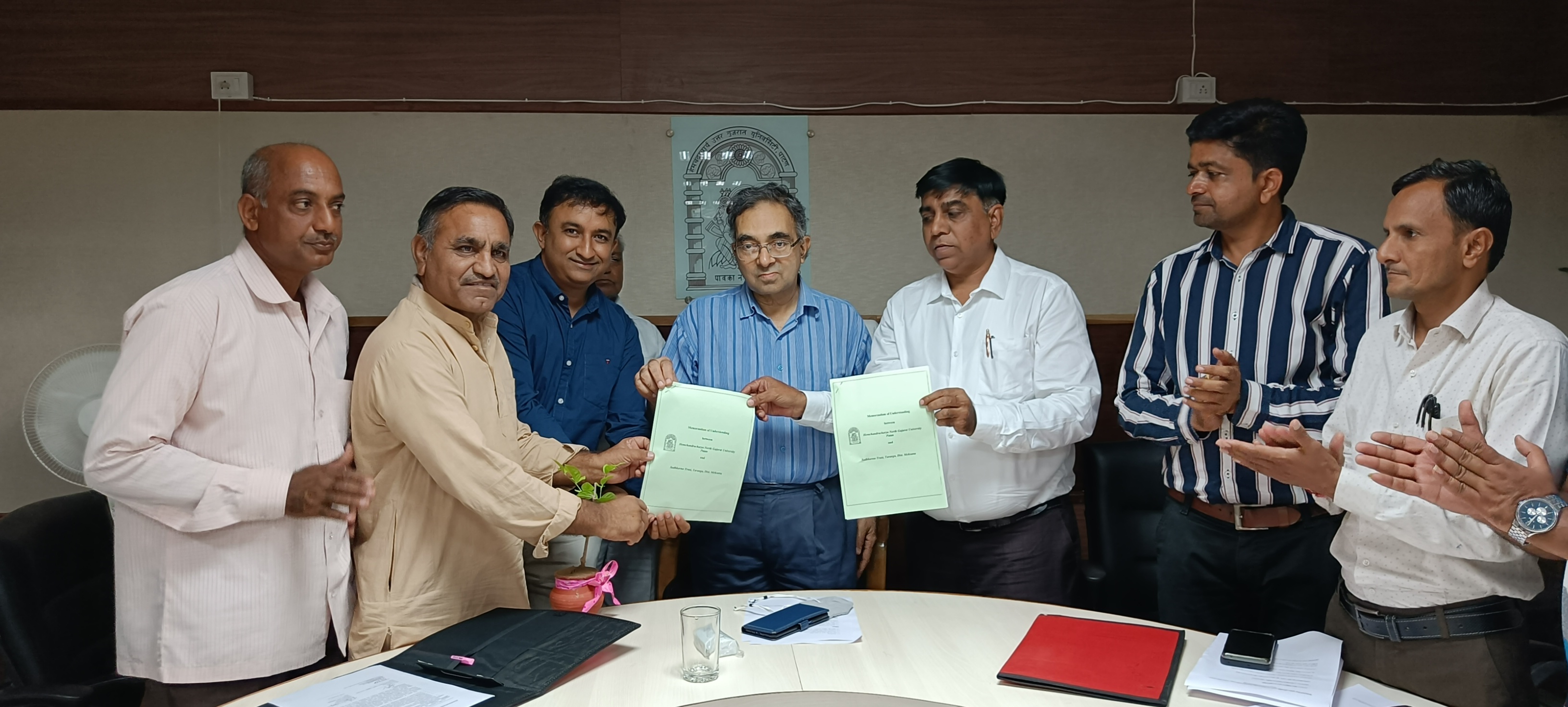 MoU between Hemchandracharya University, Sadbhavna Trust and Atri ...