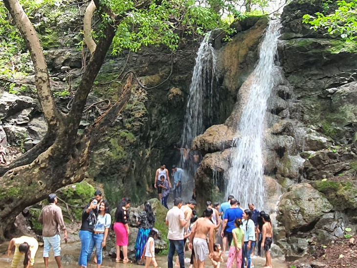 Devotees flock to Shravan at Gaumukh Falls near Mahadev Temple in Don ...