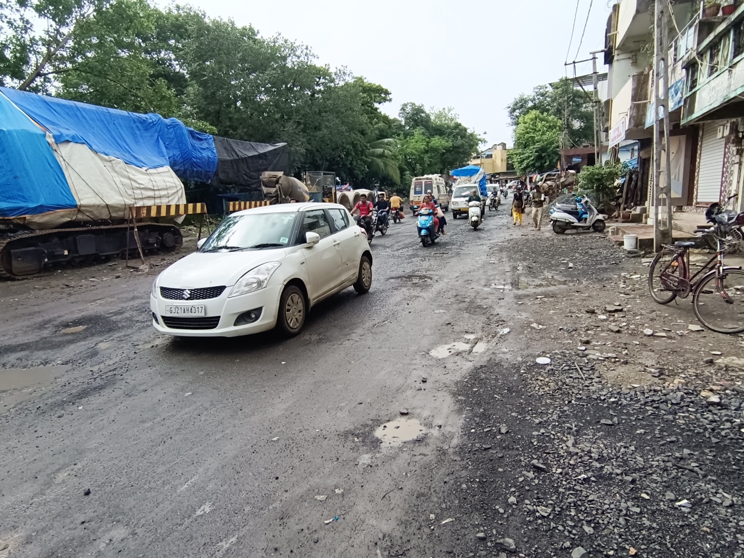 If the dilapidated roads in Navsari city are within the warranty period ...