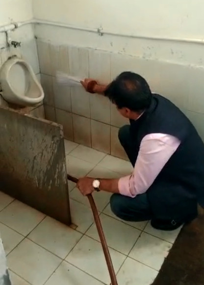 Seeing the dirtiness of the school toilet in Kamrej's Dungra village ...