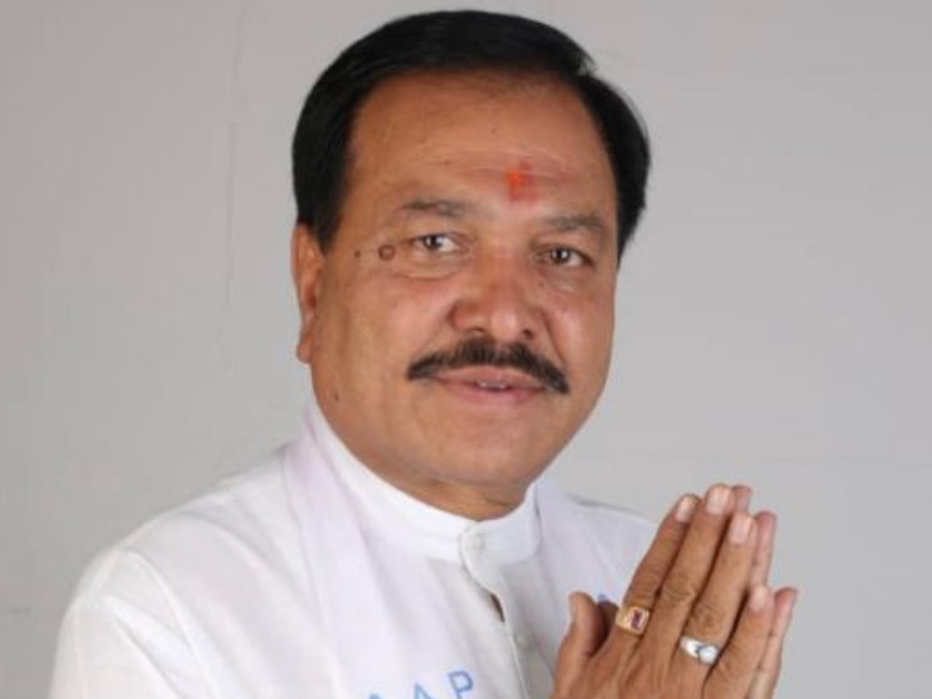 Rajkot AAP leader Vasram Sagathia sacked by party, seen at Congress ...