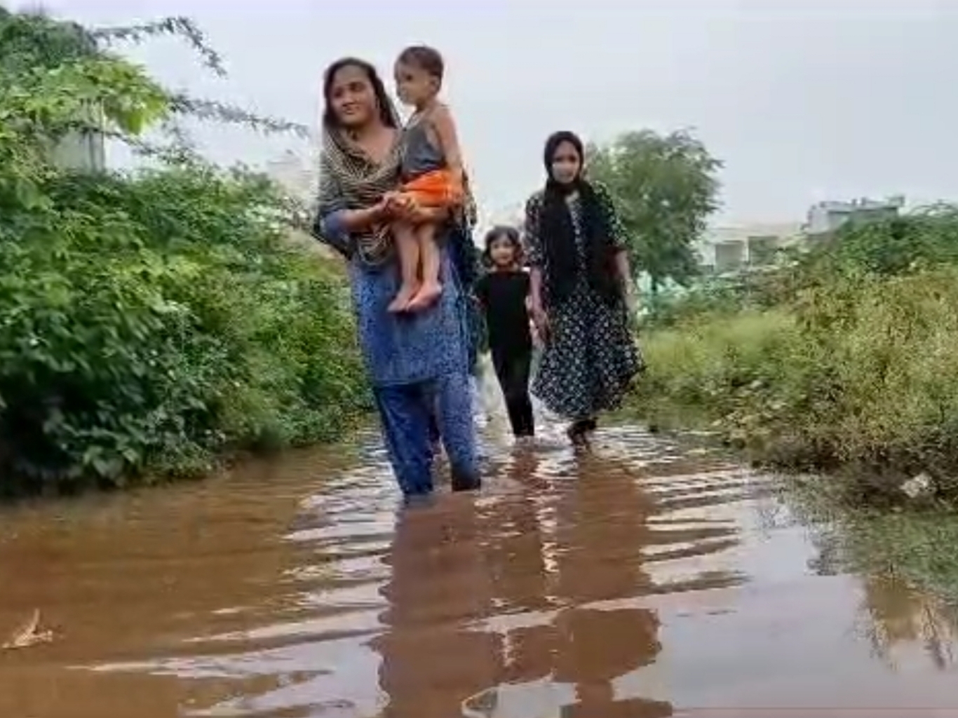 Water inundated different areas of the town; Flooding in societies is ...