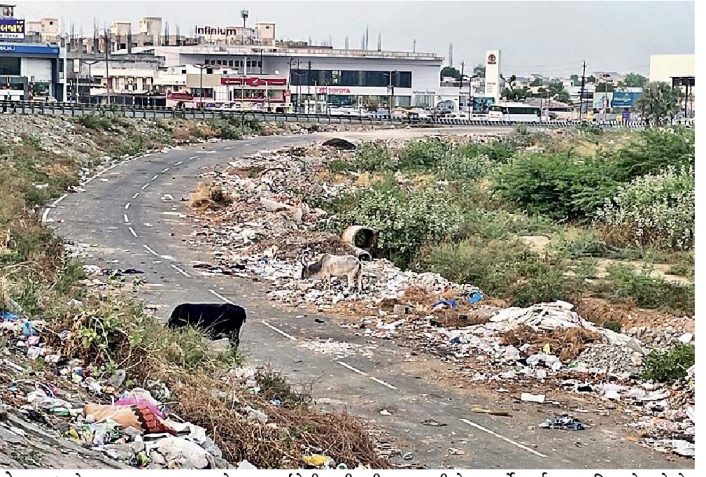 Garbage is dumped on the newly constructed road near Khari river | ખારી ...