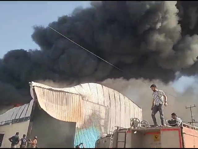 A fire broke out in a pile of oil barrels lying in an open plot at ...