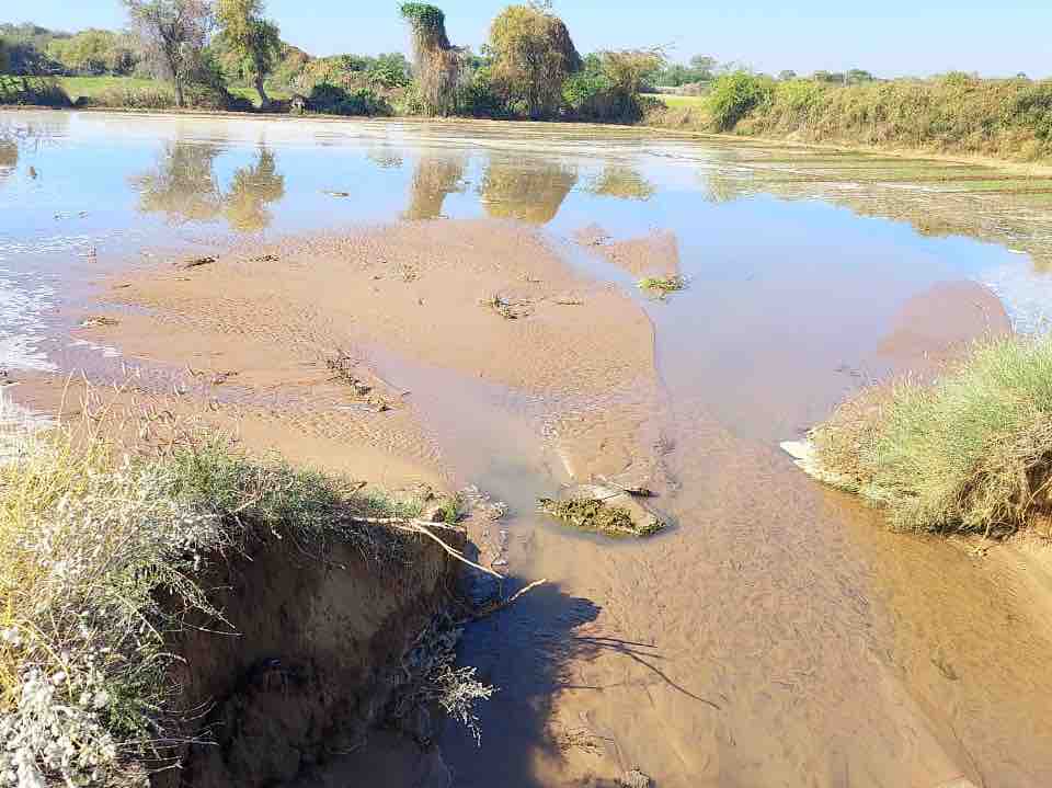 Gap in minor canal near Vavna Kareli village, damage to standing crops ...