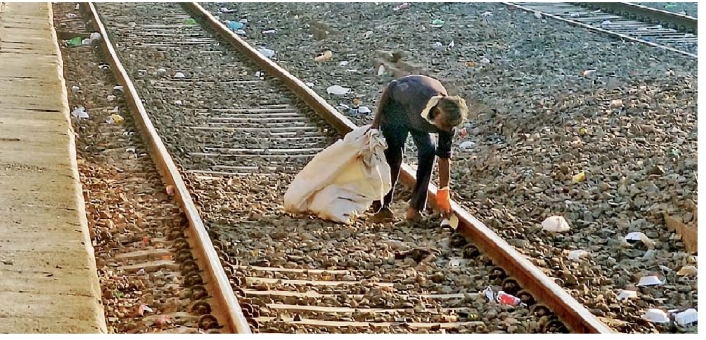 At Palanpur railway station, garbage is thrown from the window of the ...
