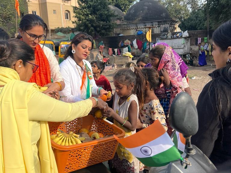 Food packets and fruits were distributed to needy people by the women ...