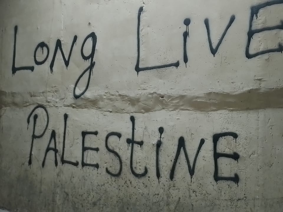 The slogan 'LONG LIVE GAZA, LONG LIVE PALESTINE' was written in black ...