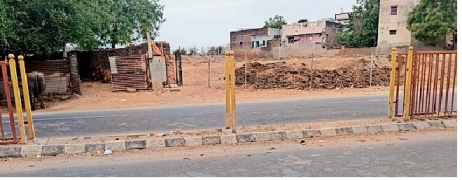Seven iron railings installed on the divider near Khodiyar Char Rasta ...