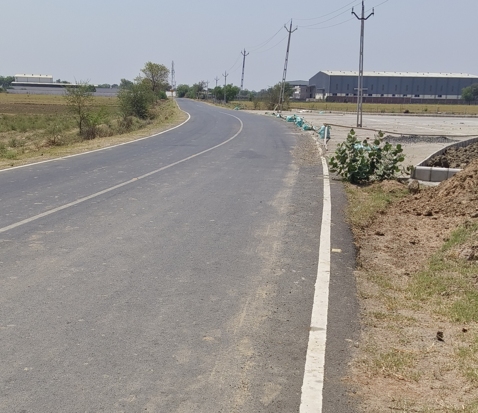 The trunk road from Khedana Navagam to Vasana Bujarg became narrow ...