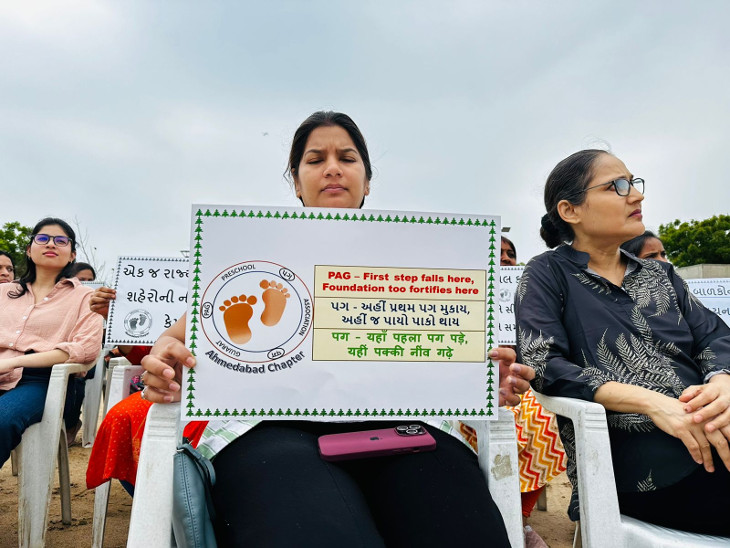 Preschool administrators at Riverfront protested with banners, saying ...