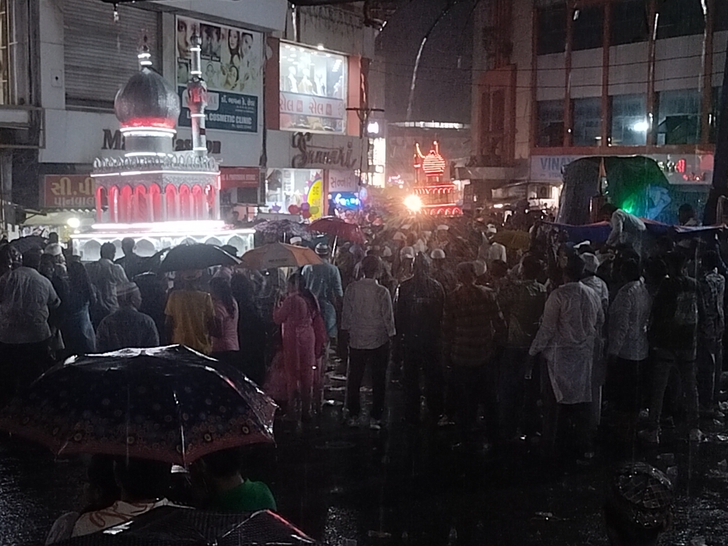 Meghmeher, people watch the artistic tajiya amid pouring rain during ...