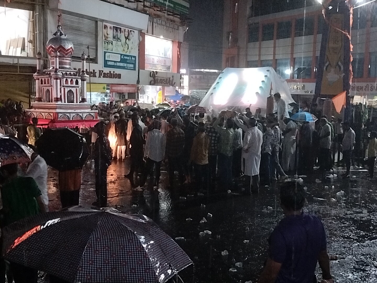 Meghmeher, people watch the artistic tajiya amid pouring rain during ...