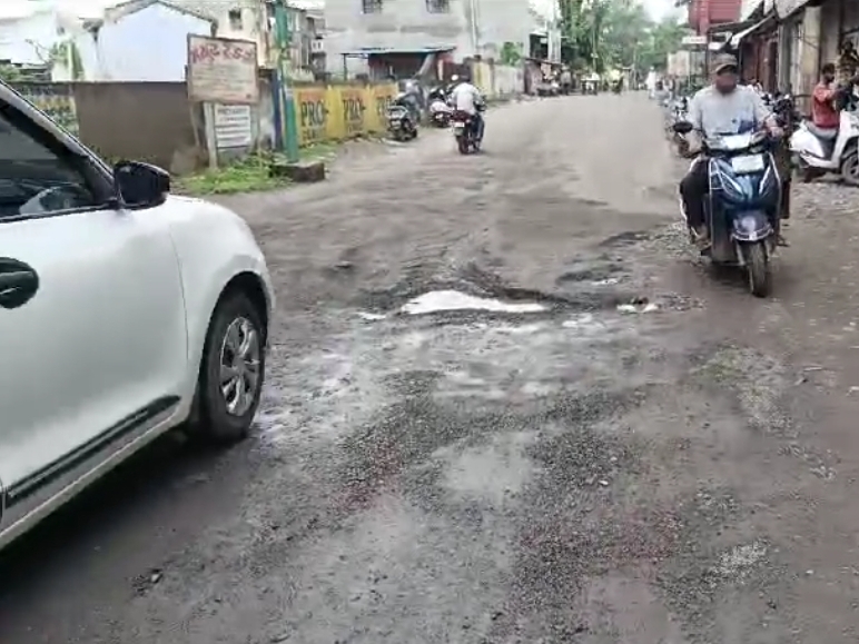 In Ankleshwar, an independent town sevak cut a cake in a pothole on the ...