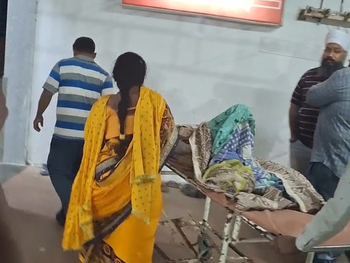 Patient's stretcher and wheelchair pushed by patient's family members ...