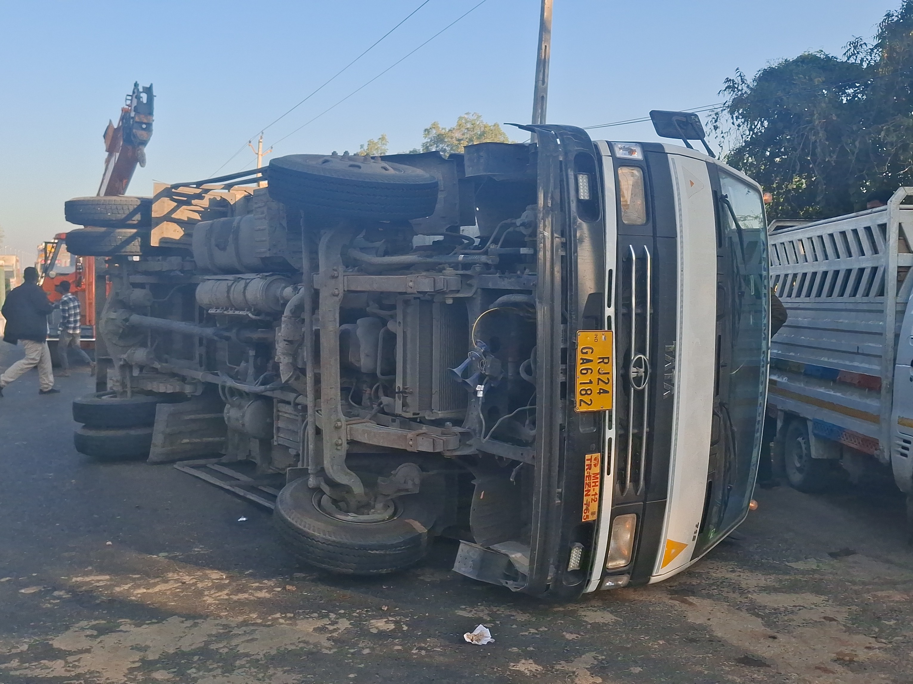 Sanand Liquor Filled Truck Overturns; Bootlegging Plan Fails PHOTOS ...
