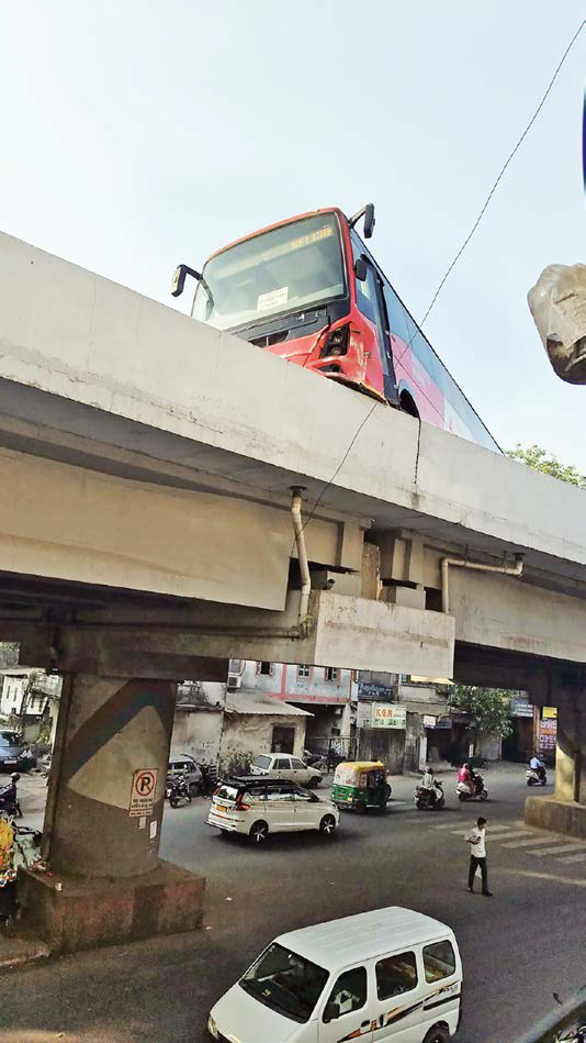 Bus escapes falling off spiral bridge in Katargam, netting required on ...