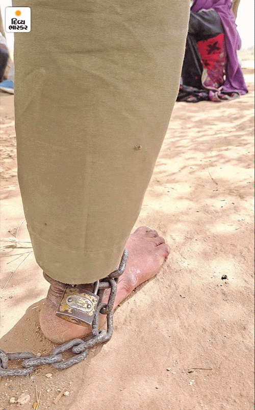 Man Chained to Tree Screaming; Mother Tied with Chain